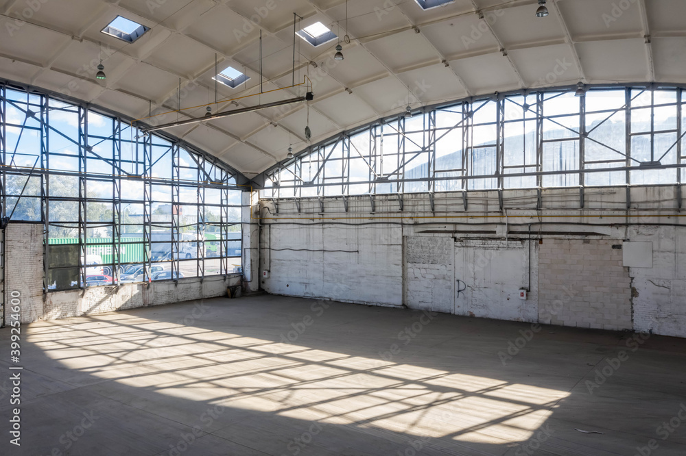 Corner of huge empty industrial warehouse. Modern building ...