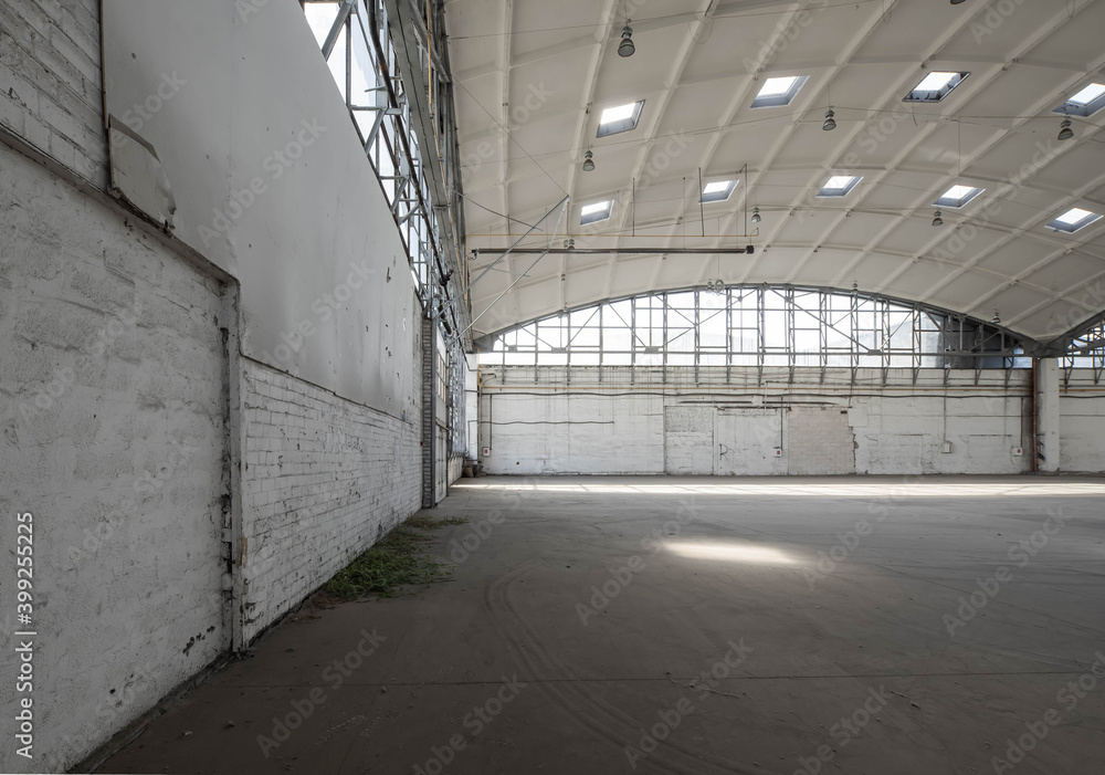 Corner of huge empty industrial warehouse. Modern building ...
