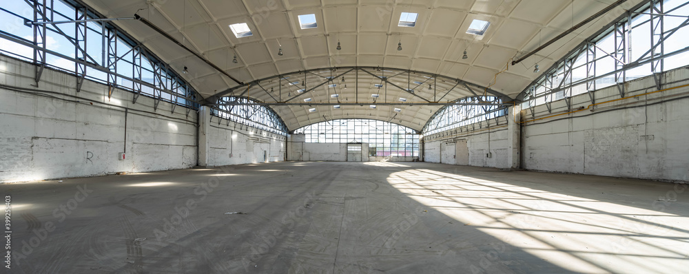 Huge empty industrial warehouse. White interior. Unique architecture ...