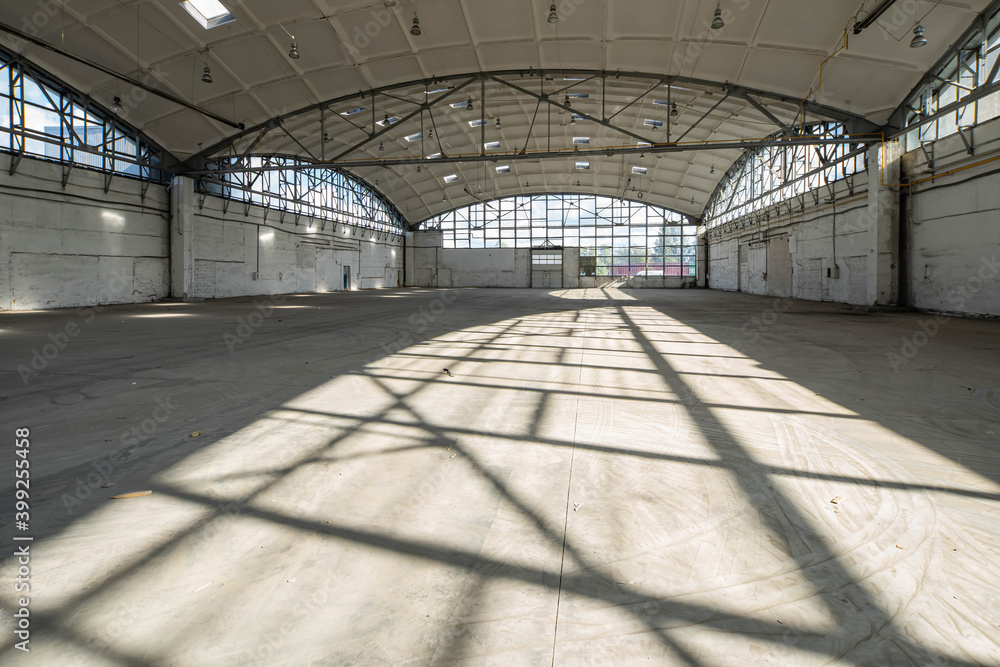 Huge empty industrial warehouse. White interior. Unique architecture ...