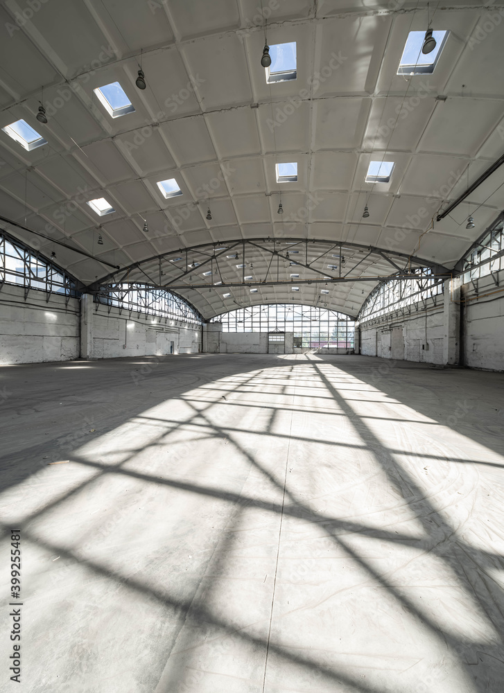 Huge empty industrial warehouse. White interior. Unique architecture ...