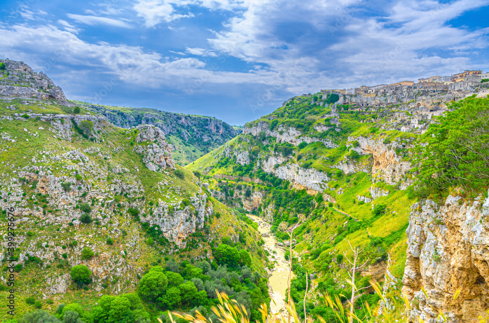 Aerial view of ravine canyon with rocks and caves di Murgia Timone near ...