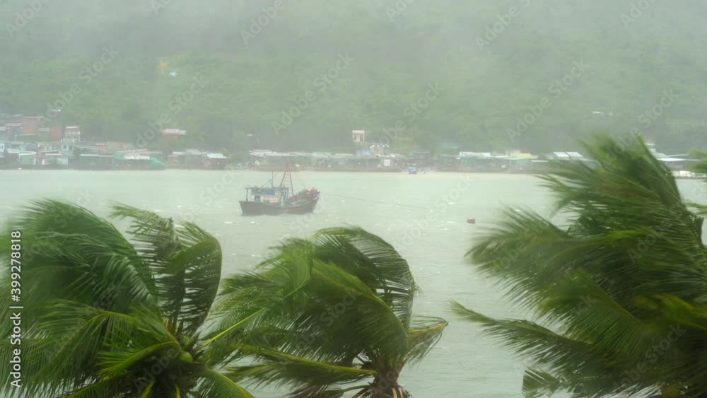 Ships in a harbor under a heavy rain and storm wind. Tropical storm ...