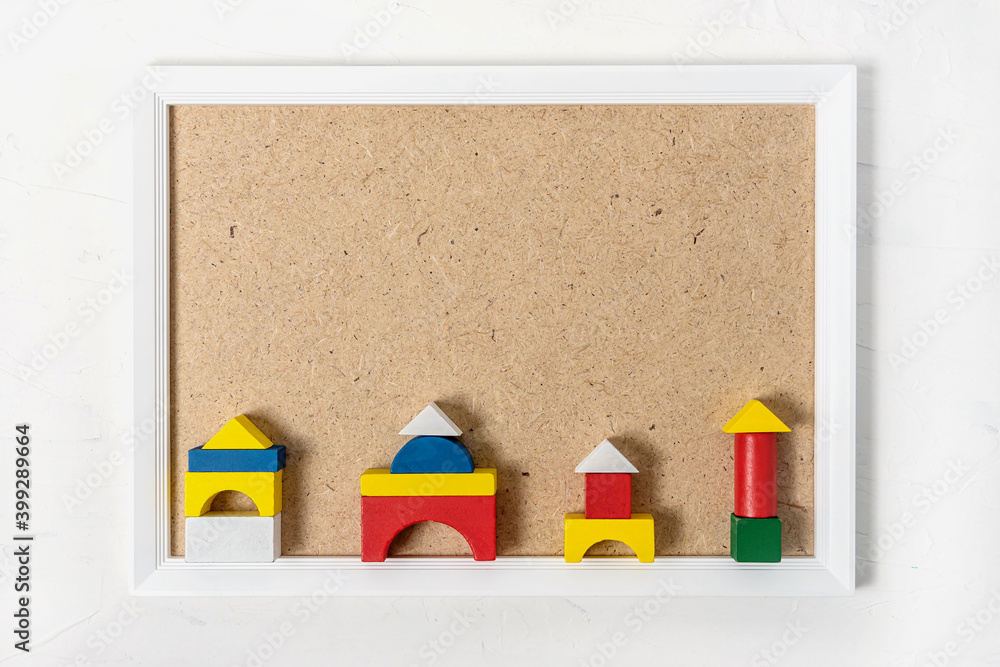 Colorful wooden blocks frame on white background, top view with copy ...