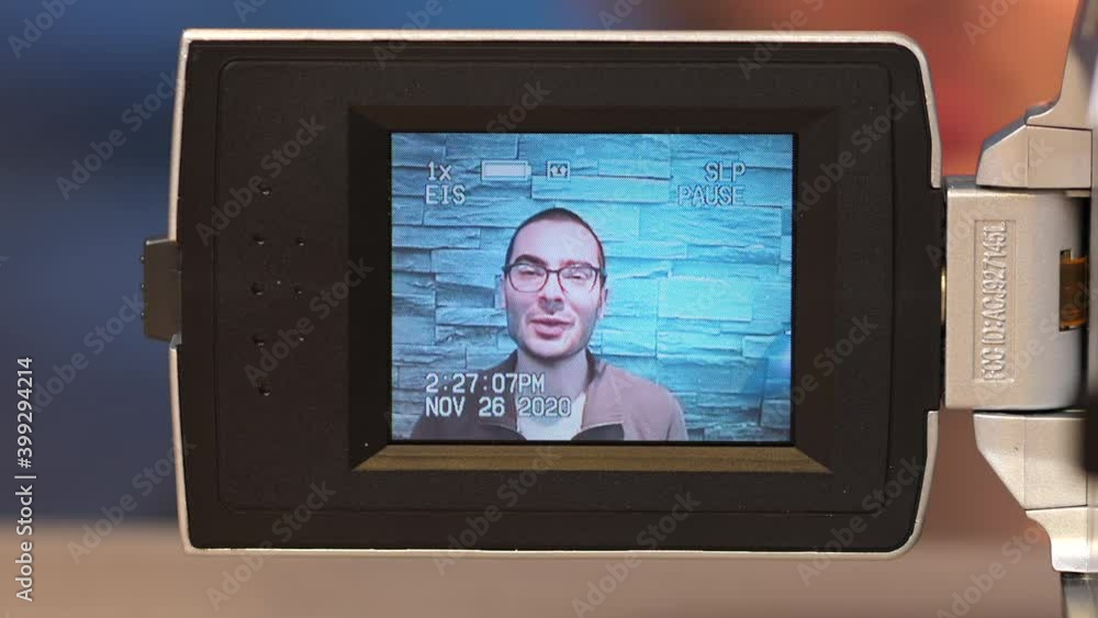 Old retro vhs camcorder from the 80s 90s filming a man. Closeup on the ...