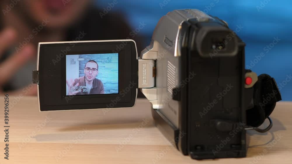 Old retro vhs camcorder from the 80s 90s filming a man. Closeup on the ...