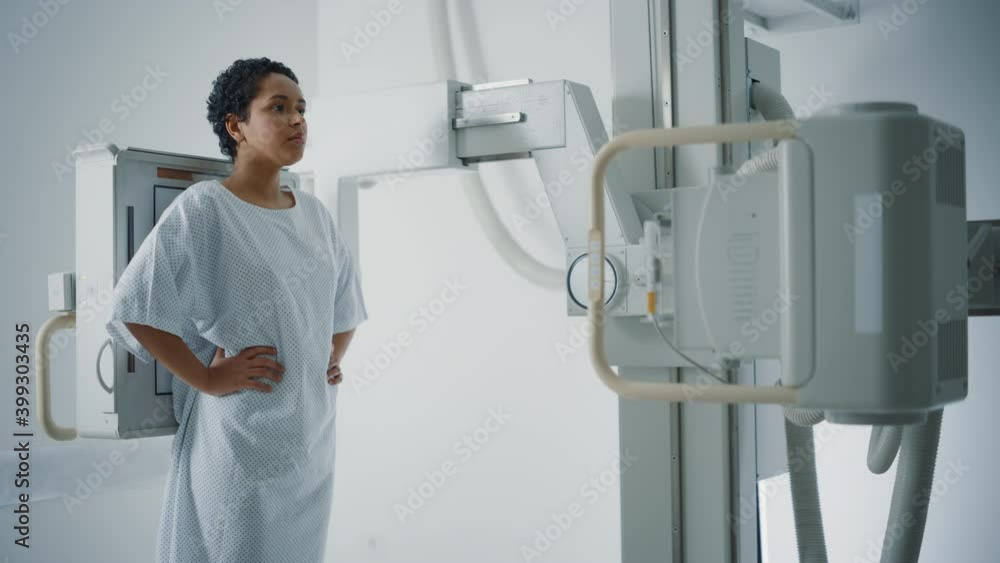 Hospital Radiology Room: Beautiful Latin Woman Standing next to X-Ray ...
