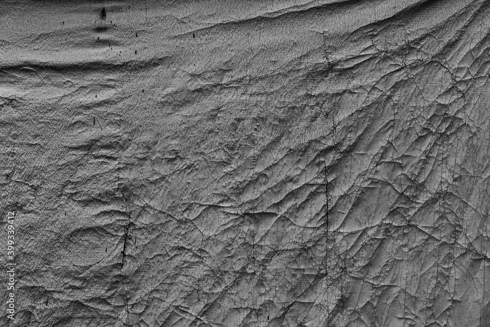 Battered creased faded blind. Folded shabby jute vinyl tent. Dirty ...