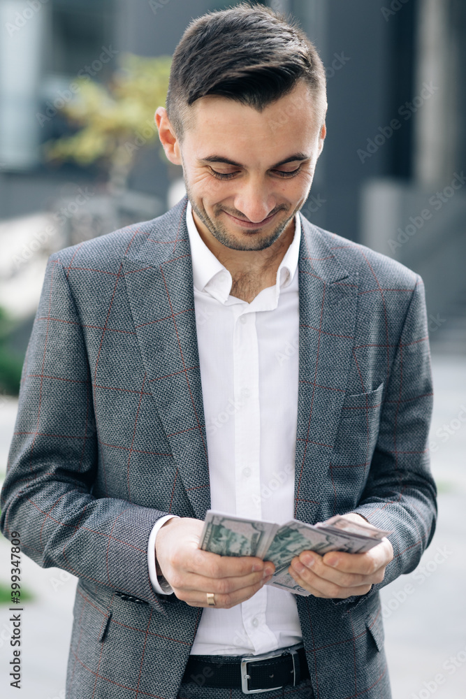 Handsome Rich Man Wearing Stylish Suit Counting Money Standing in the ...
