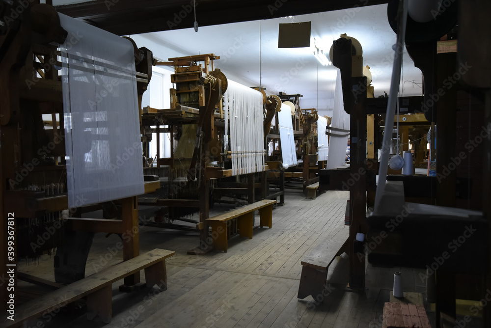 A traditional weaving workshop Factory with old manual wooden loom ...
