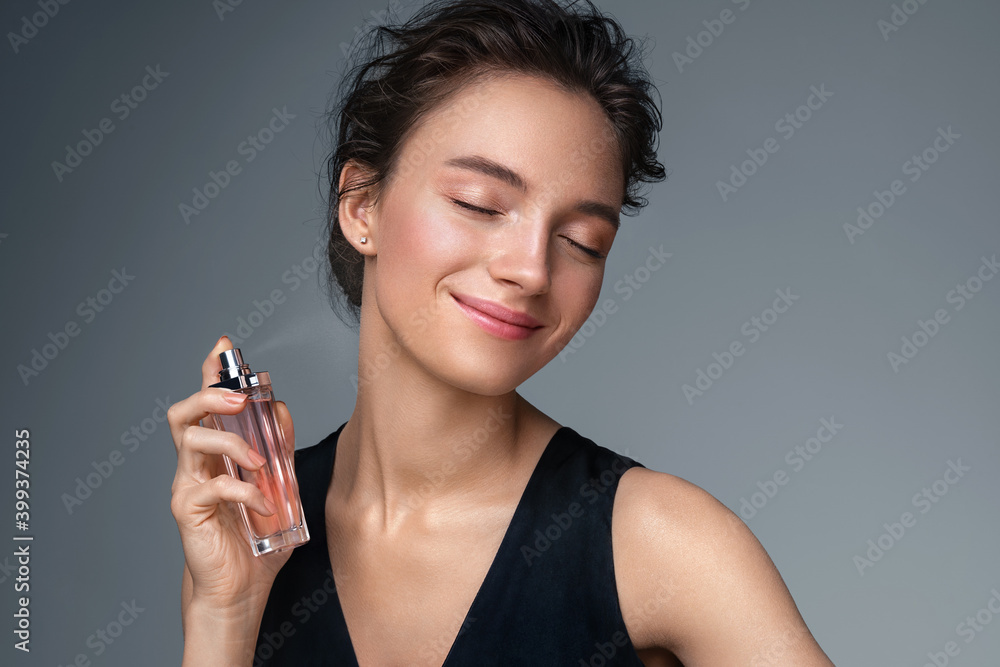 Woman with bottle of perfume. Photo of woman with perfect makeup on ...