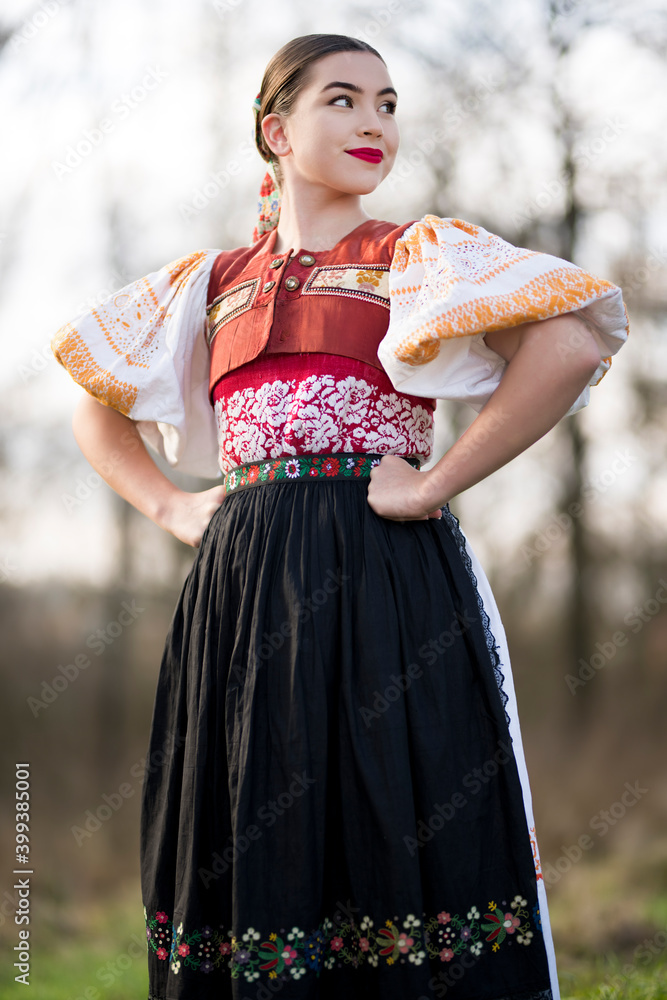 Young beautiful slovak woman in traditional dress. Slovak folklore ...