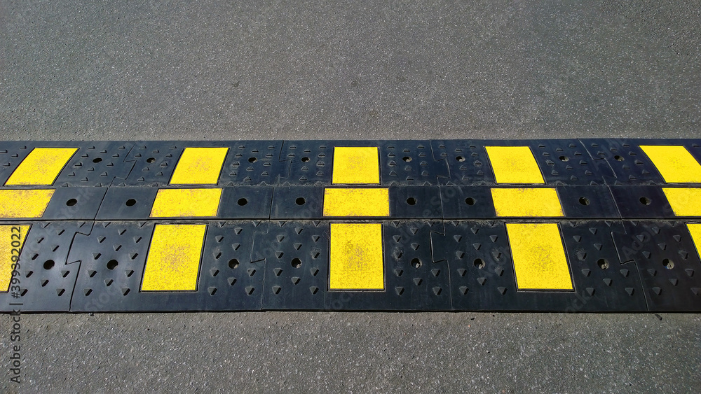 Caution speed bump with Illuminating yellow rectangles. Sleeping ...