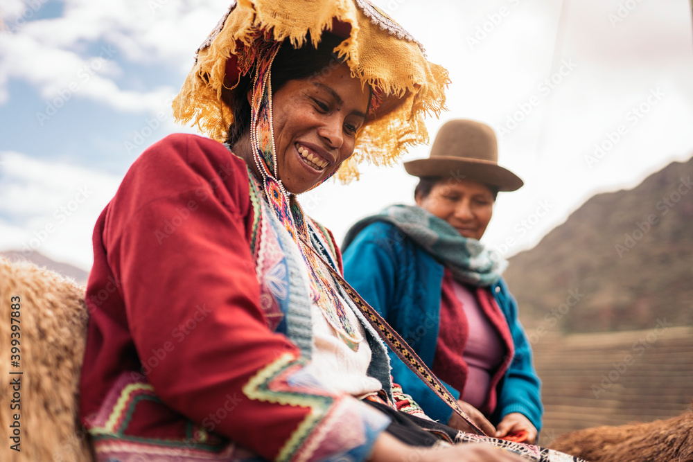 Peruvian women working together Stock Photo | Adobe Stock
