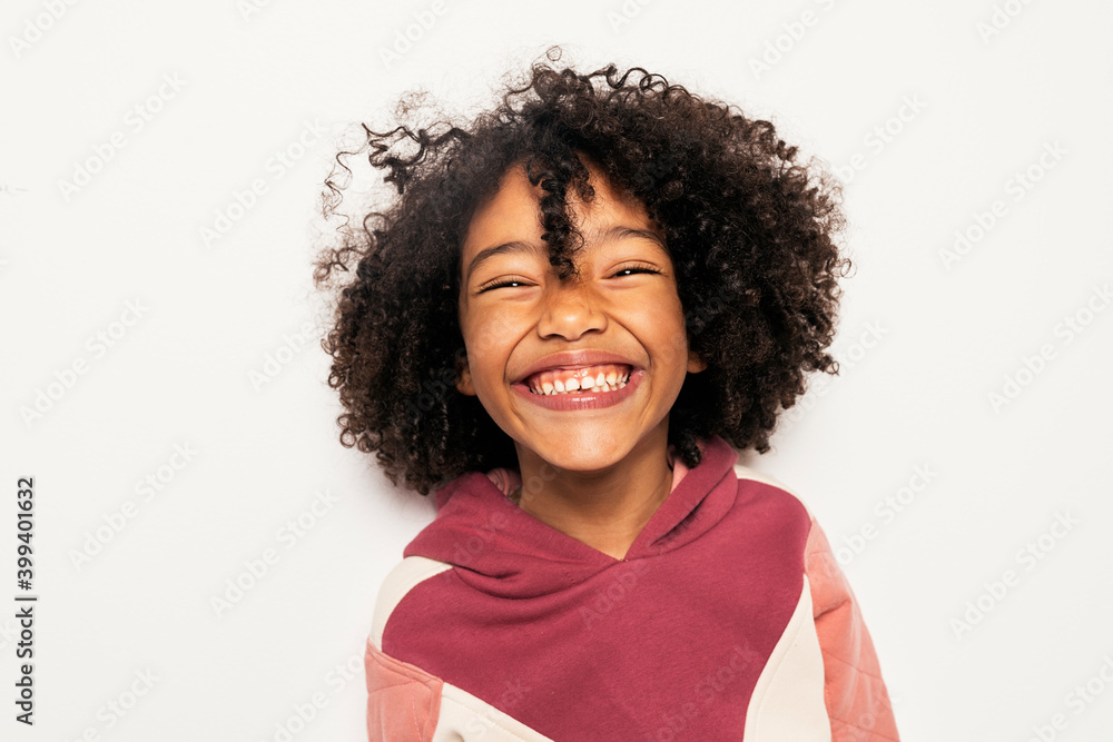 Black kid in studio smiling. Stock Photo | Adobe Stock