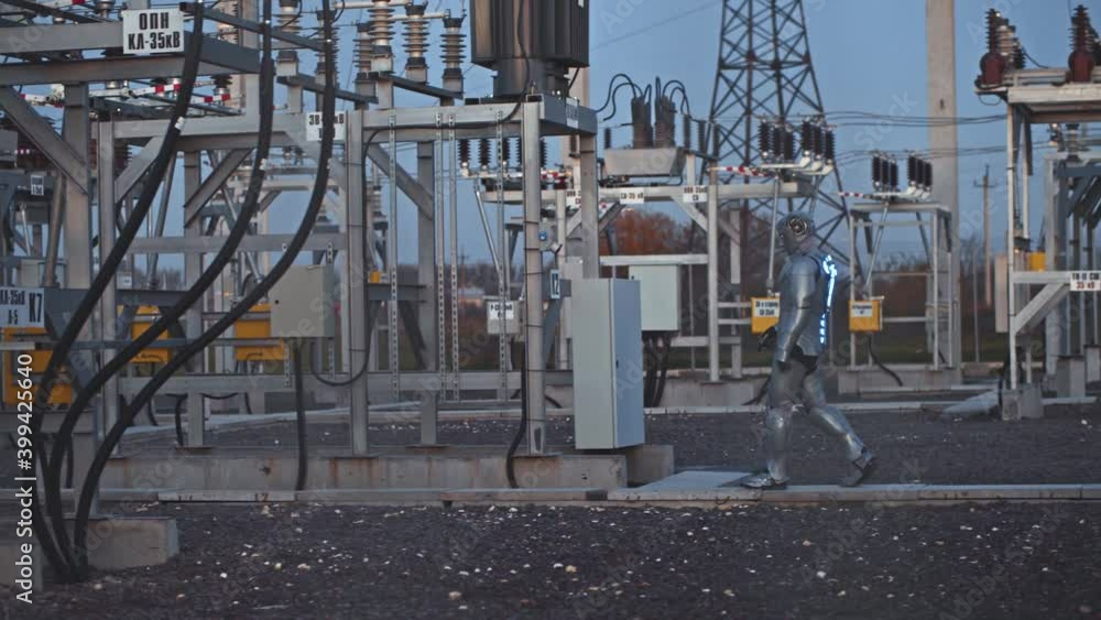 Cyber droid prototype worker walking on solar field construction to ...