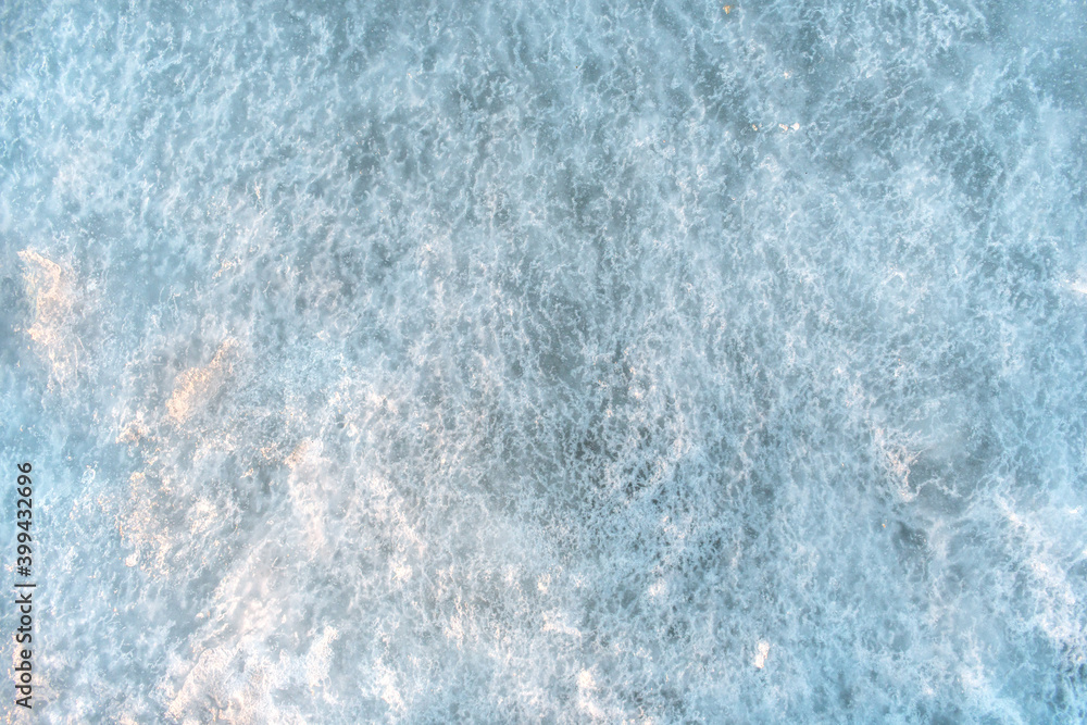 Sea ice texture. Frozen sea water with congealed small bubbles inside ...