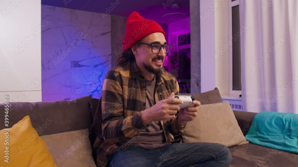 Excited man playing video games on modern console next gen 2020, new ...