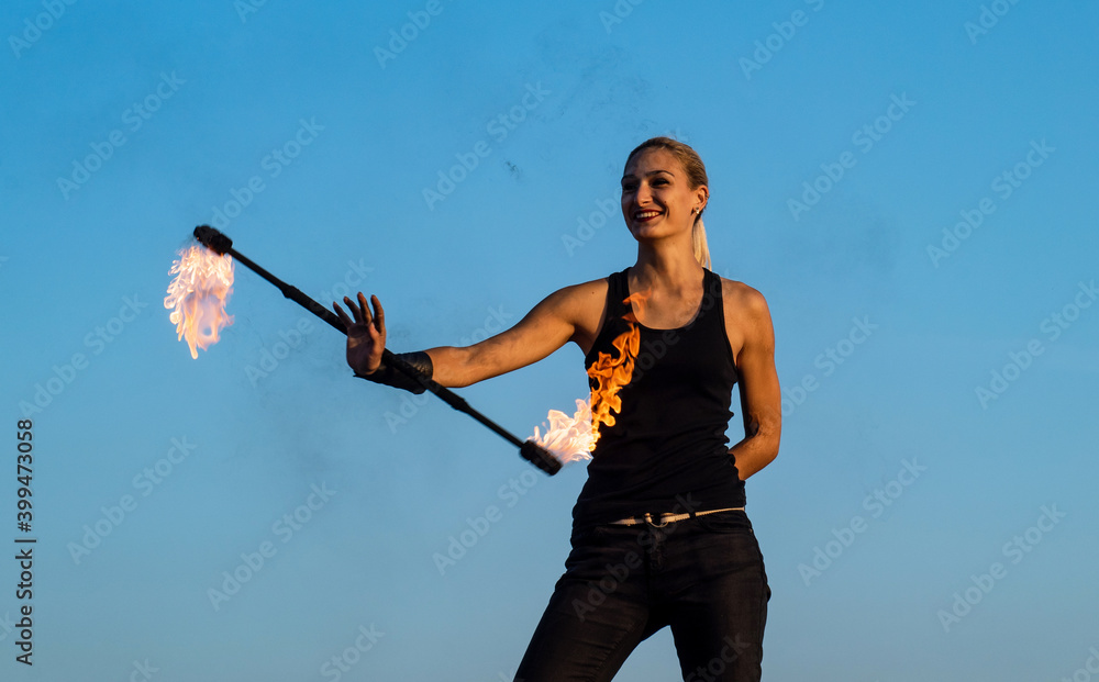 Total dedication for flame. Happy woman enjoy twirling baton. Sexy girl ...