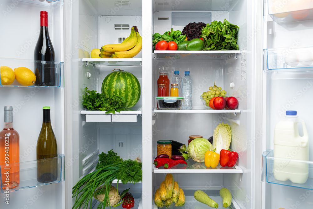 Open fridge full of fruits, vegetables and drinks Stock Photo | Adobe Stock