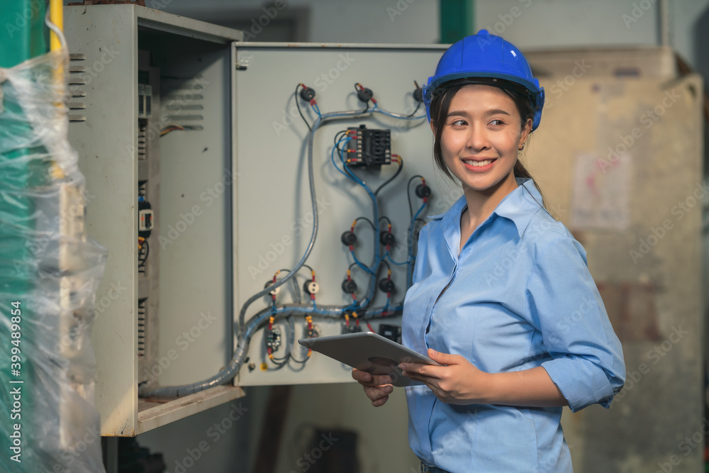 electrical engineer checking and maintenance electric control ...