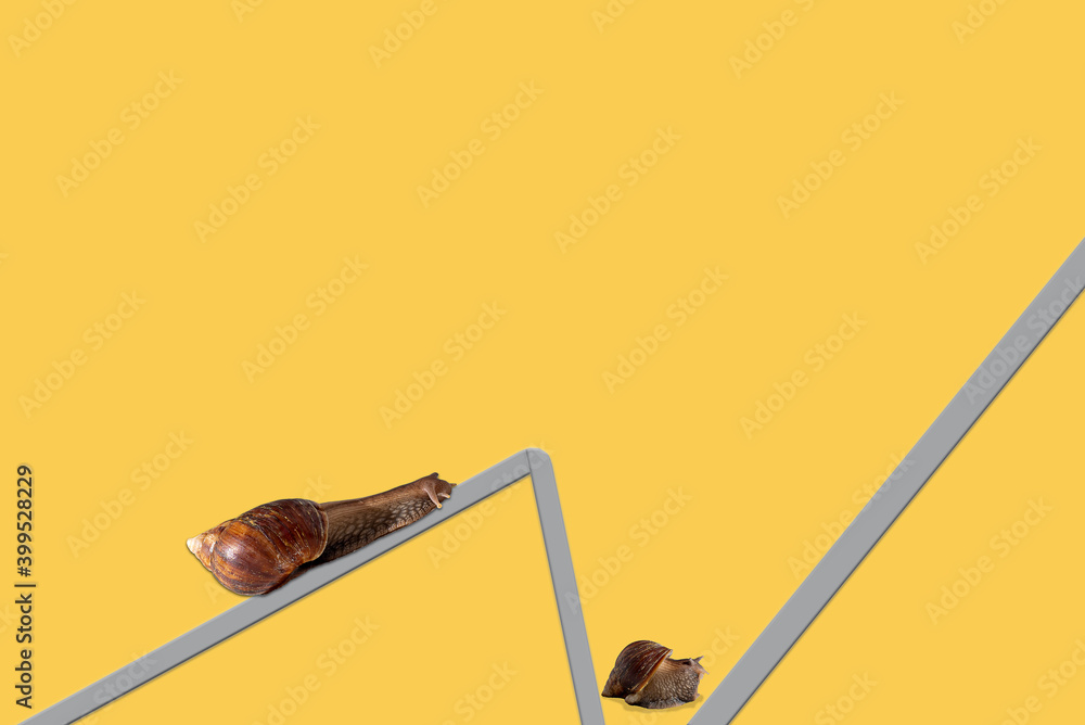 Rise and fall. A snail crawls up an inclined plane, a second snail at ...