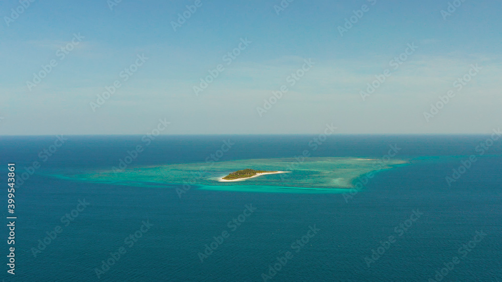 Tropical island Canimeran with sandy beach in the blue sea with coral ...