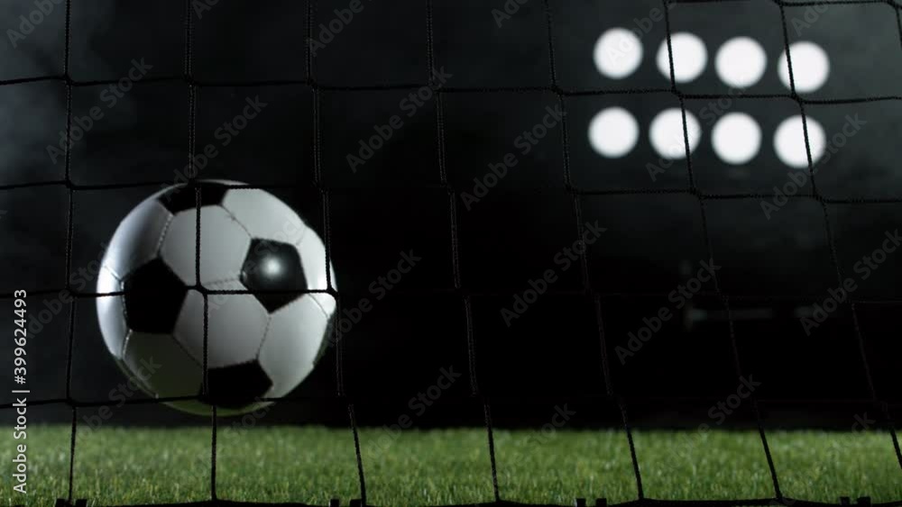 Super slow motion of soccer ball flying into goal. Filmed on high speed ...