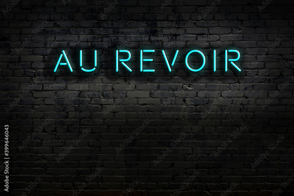 Neon sign. Word au revoir against brick wall. Night view Stock ...
