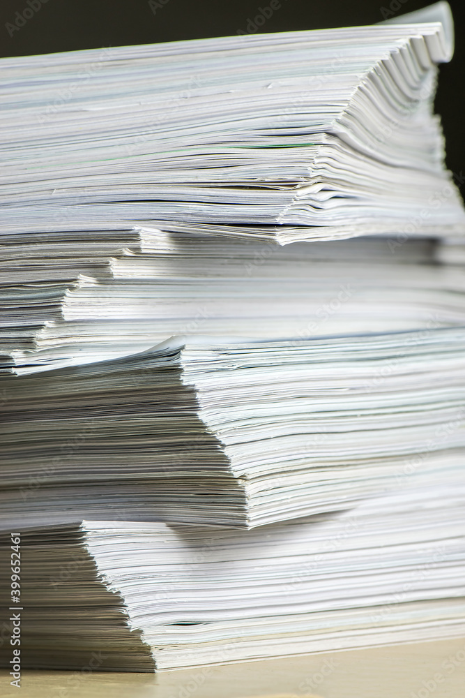 bundles bales of paper documents. stacks packs pile on the desk in the ...
