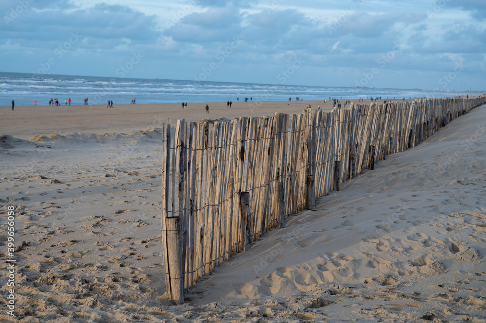 Sand fence on wide windy beach of North sea near Zandvoort in ...