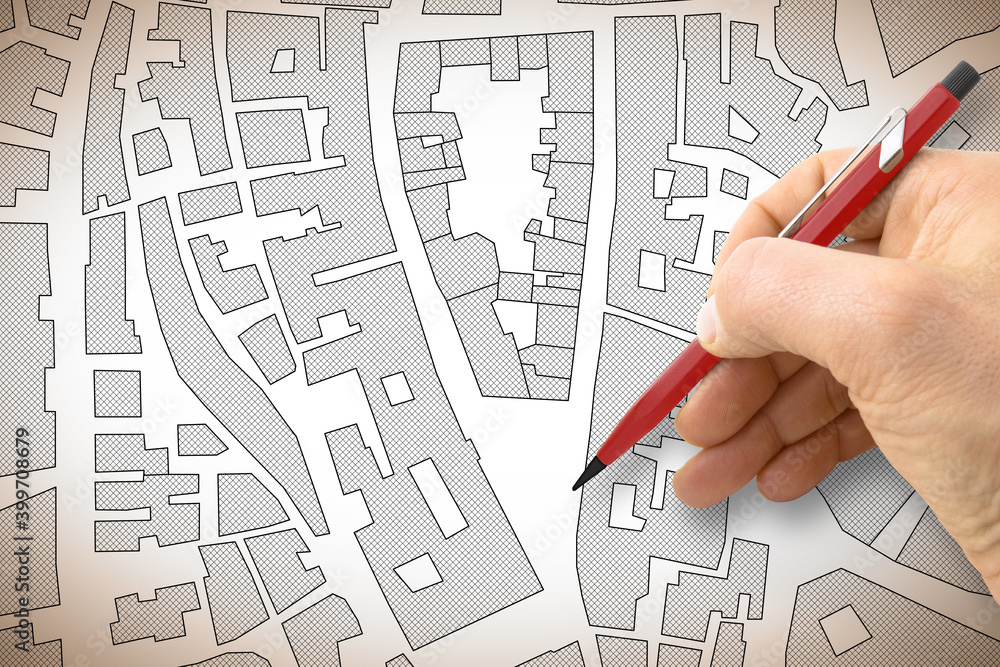 Engineer drawing an imaginary map of an historical center of an old ...
