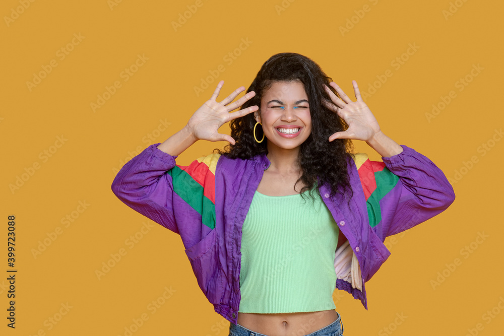 Cute Dark Haired Young Girl In Bright Jacket Smiling Happily Stock