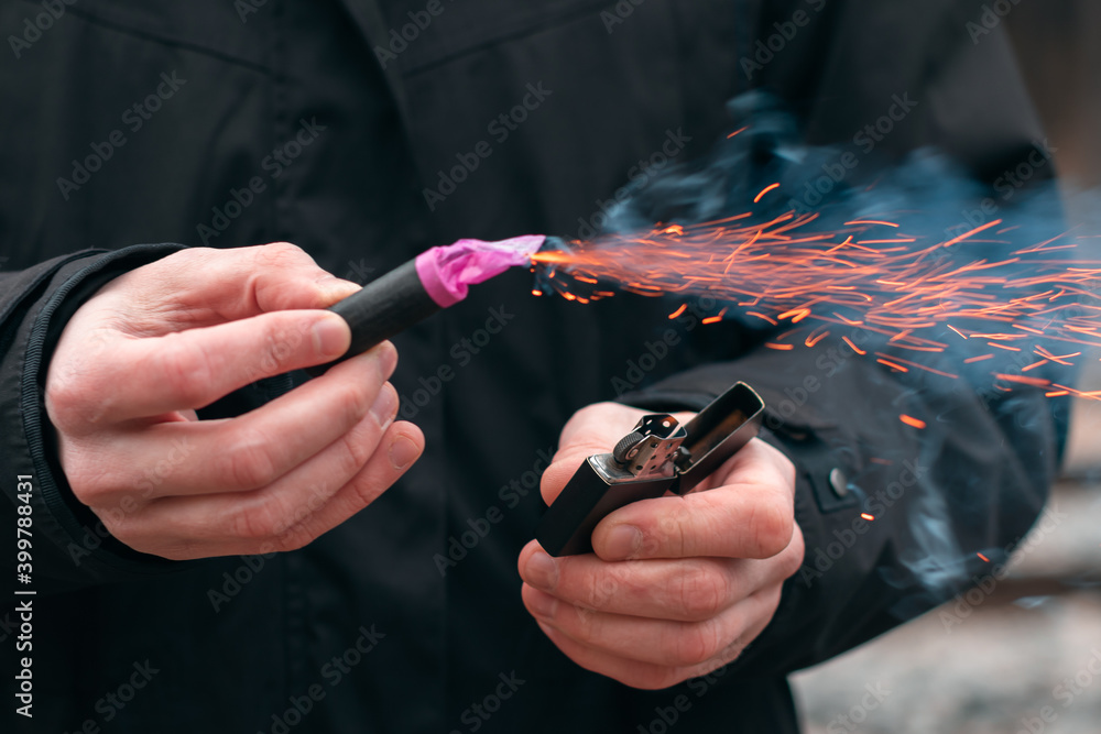 The Firecracker in a Hand. Man Holding a Burning Petard in His Hand. A ...