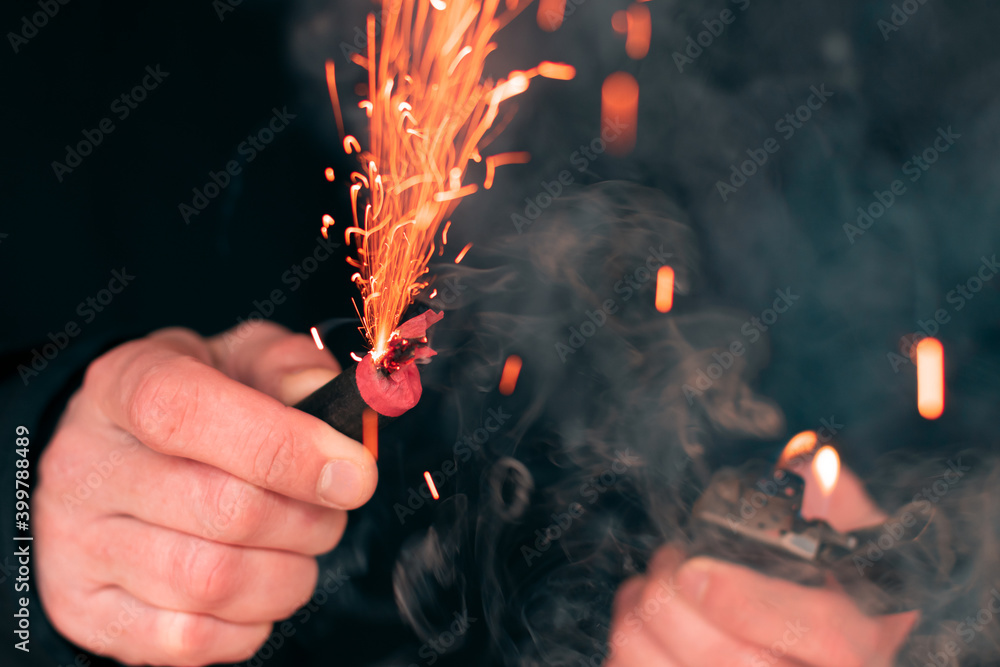 The Firecracker in a Hand. Man Holding a Burning Petard in His Hand. A ...