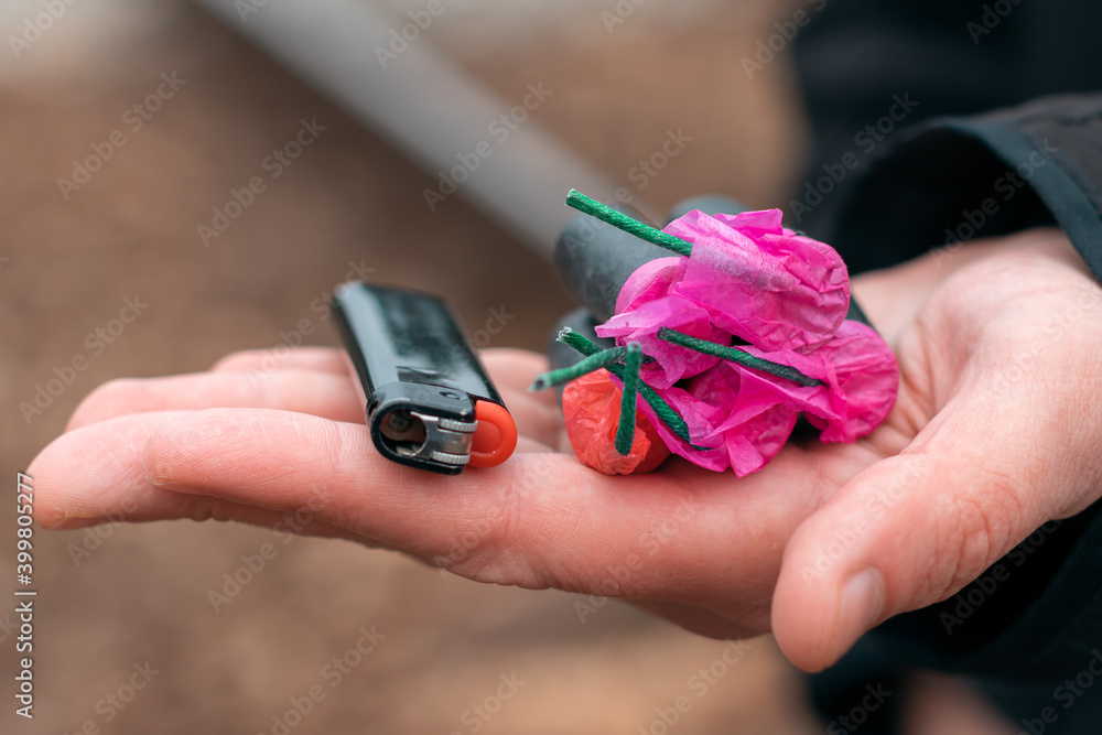 The Firecrackers in a Hand. Man Holding Five Black Petards with a Gas ...