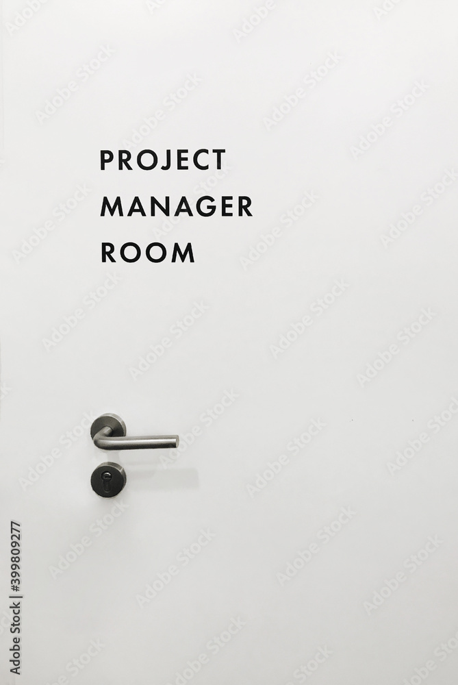 Project Manager Room Door with sign on it and a door handle with key ...