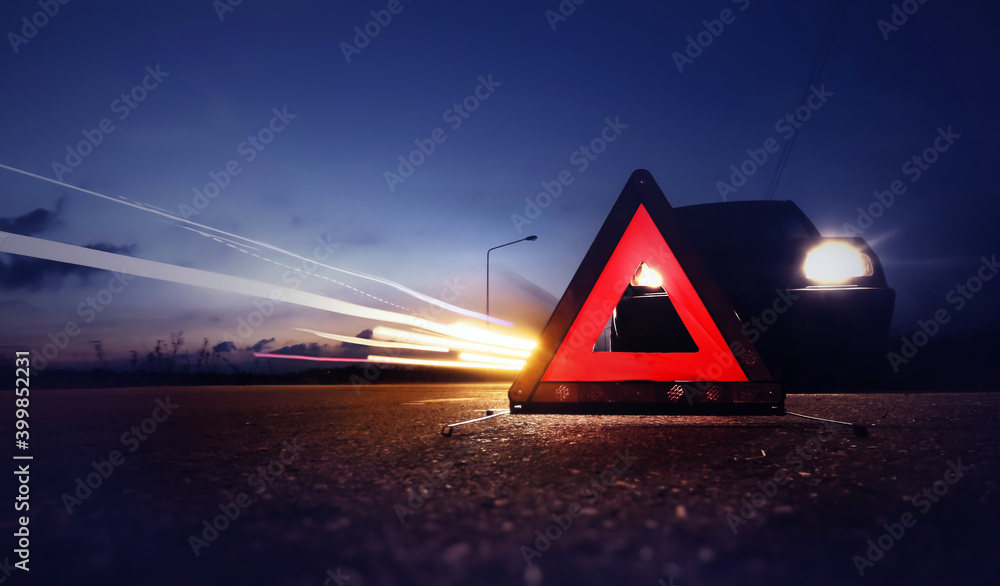 Red emergency stop sign (red triangle warning sign) with long-exposure ...