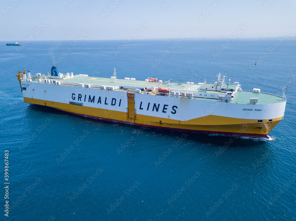 Grimaldi Lines RoRo Roll on-Off vessel cruising slowly at sea. Stock ...