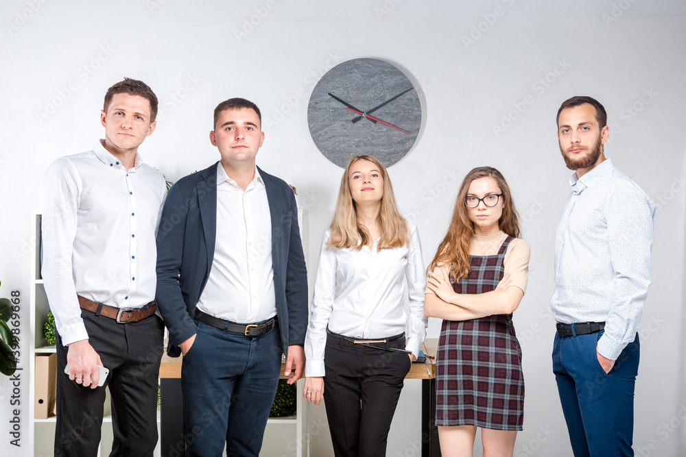 Smiling employees standing looking camera making team picture in office ...