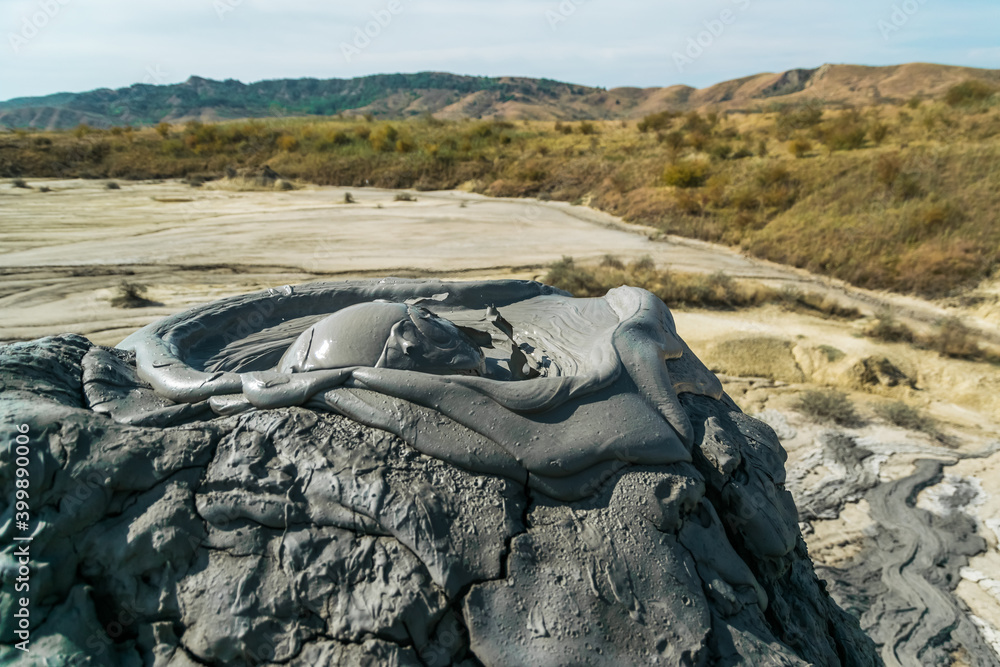 Active mud volcano eruption with a mud bubble exploding captured in ...