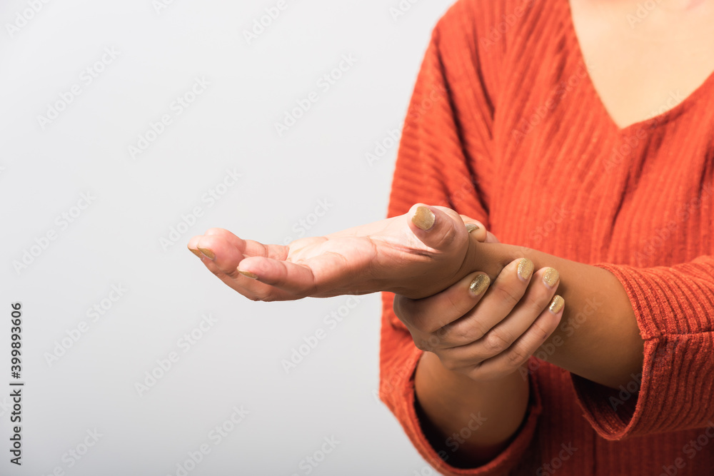 Close up hand of Asian woman she holding her acute pain in wrist of ...