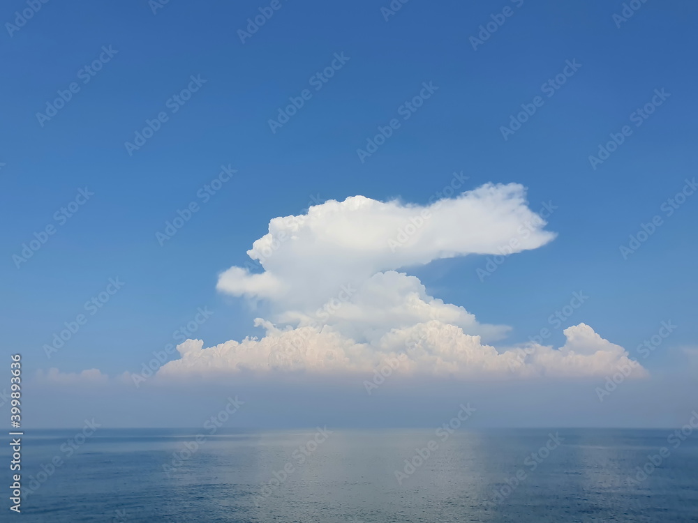 Bright blue sky and white clouds with the sea below is the beauty of ...
