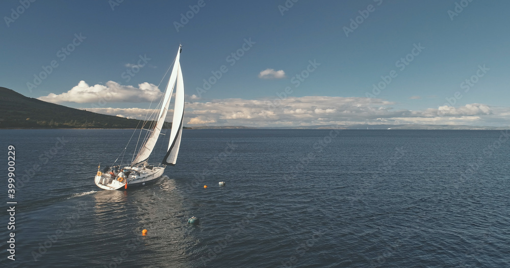 Yacht sail cruise aerial. Sailboat reflect at ocean water. Mountain ...