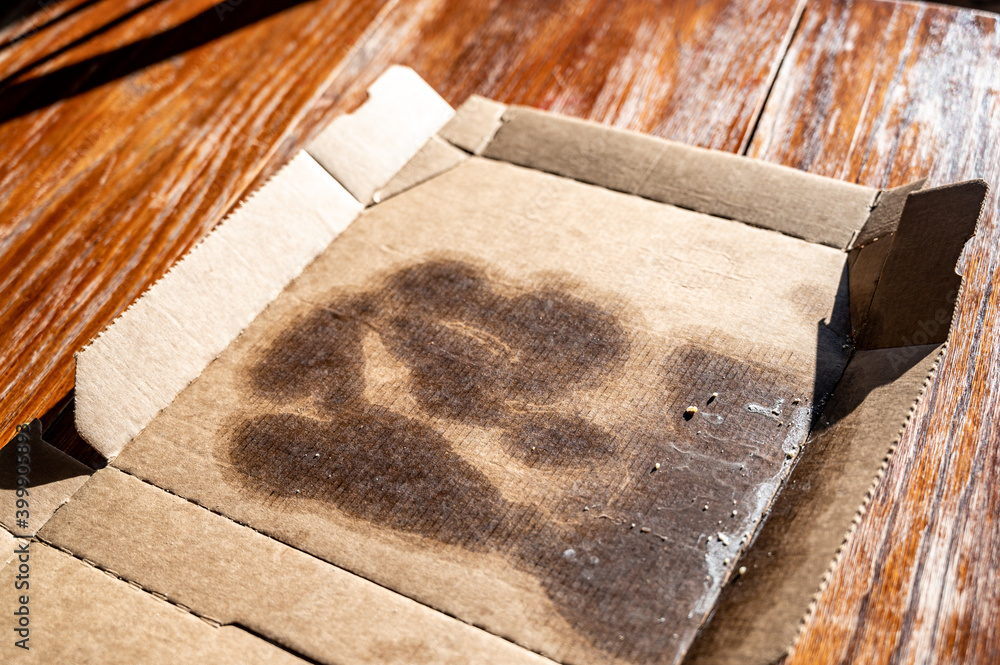 Food contaminated nonrecyclable cardboard pizza box Stock Photo | Adobe ...