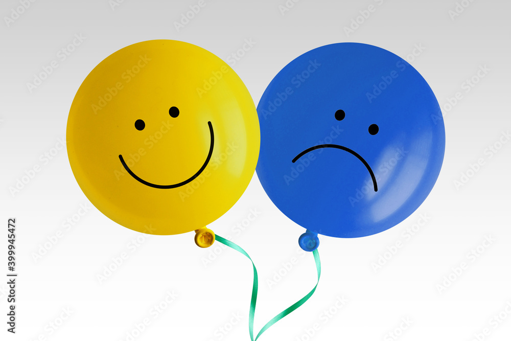 Happy and sad balloon tied together on white background - Concept of ...