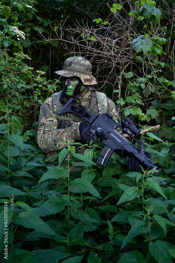 Croatia recon forces soldier camouflaging in the forest with the Cropat ...