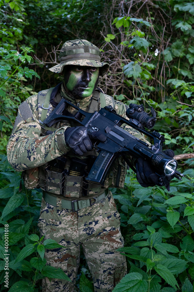 Croatia recon forces soldier camouflaging in the forest with the Cropat ...