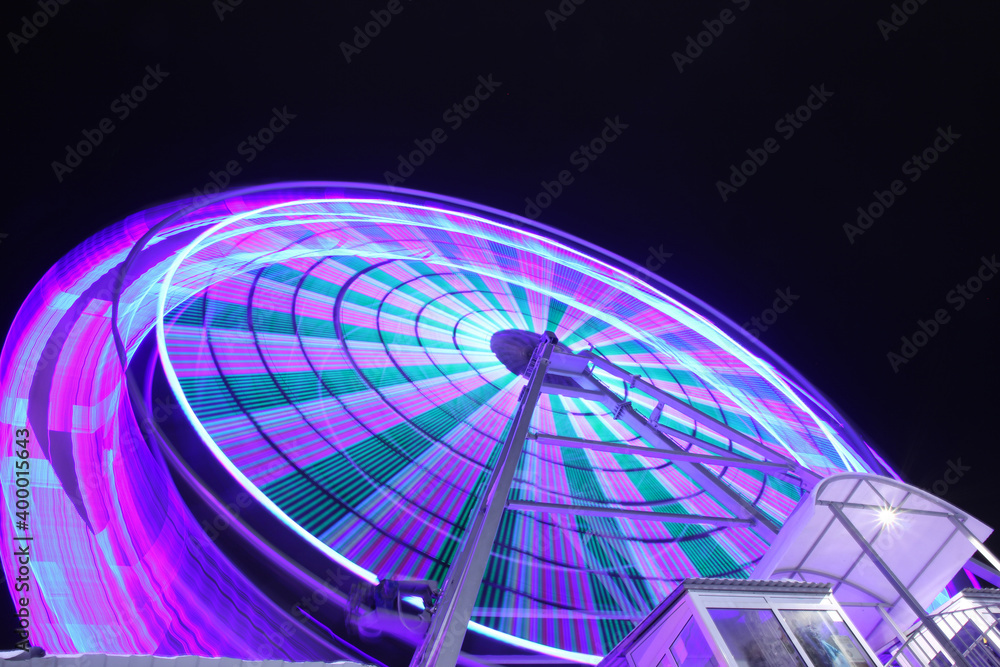 The Ferris wheel is spinning on a long shutter speed Stock Photo ...