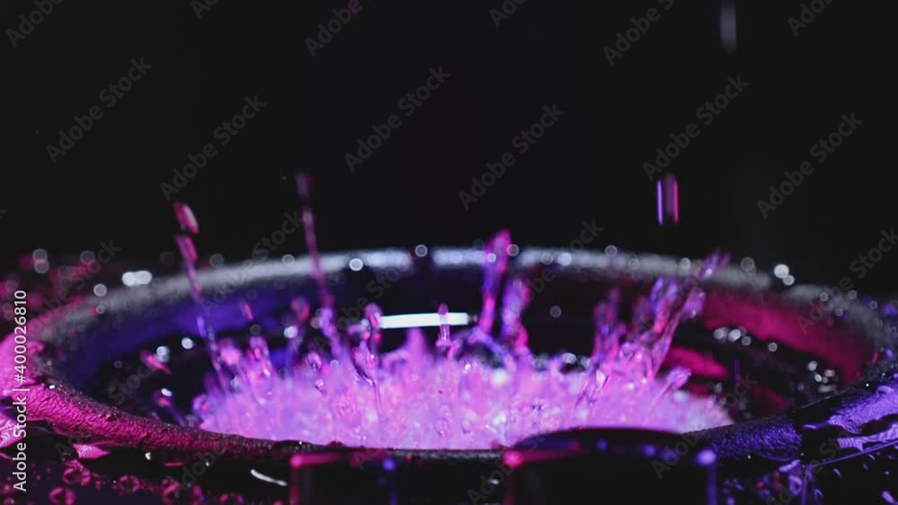 Abstract concept of powerful sound speakers throwing powder in blue ...